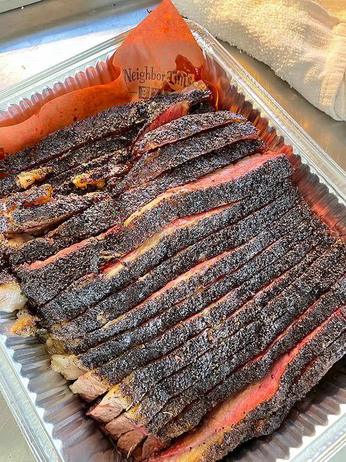 Behold the holy grail of BBQ – brisket with a bark so perfect it should be hanging in the Louvre. That smoke ring is pure poetry.