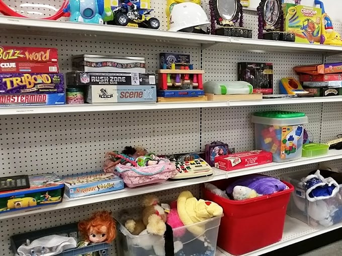 Board games, action figures, and childhood memories line these shelves – one person's outgrown toy is another's nostalgic treasure or child's next obsession.