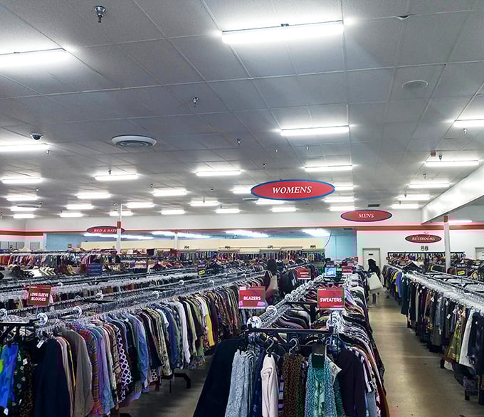 A sea of clothing stretches to the horizon under clear department signs—organization that would make Marie Kondo nod in approval.
