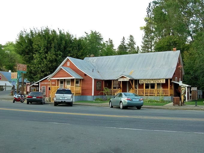 Red wooden buildings with wraparound porches—the architectural equivalent of a warm hug from your favorite aunt who always has cookies waiting.