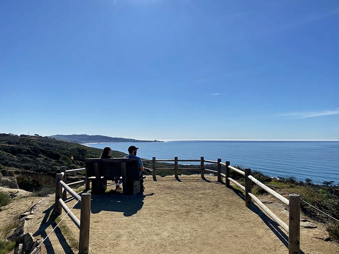 A viewing platform that turns ordinary mortals into momentary gods, overlooking a coastline that makes your Instagram followers genuinely jealous.