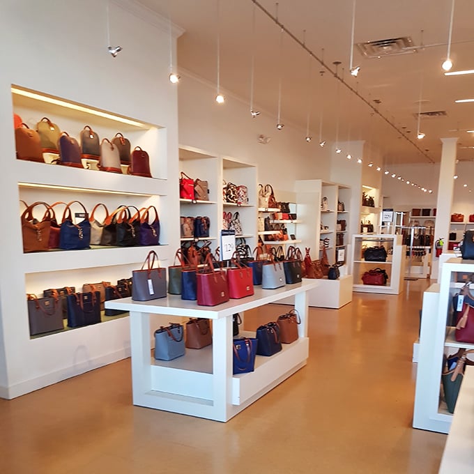 A handbag lover's dream come true—this color-coordinated display could make even the most budget-conscious shopper whisper, "Just one more won't hurt."