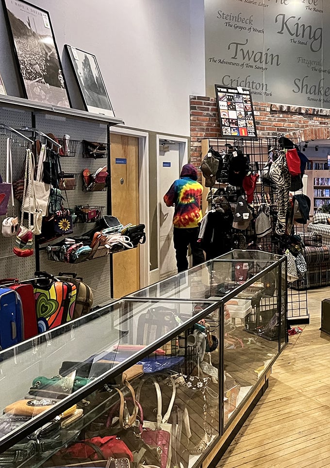 Literary giants watch over shoppers from the wall while accessories dangle like possibilities waiting to be discovered.