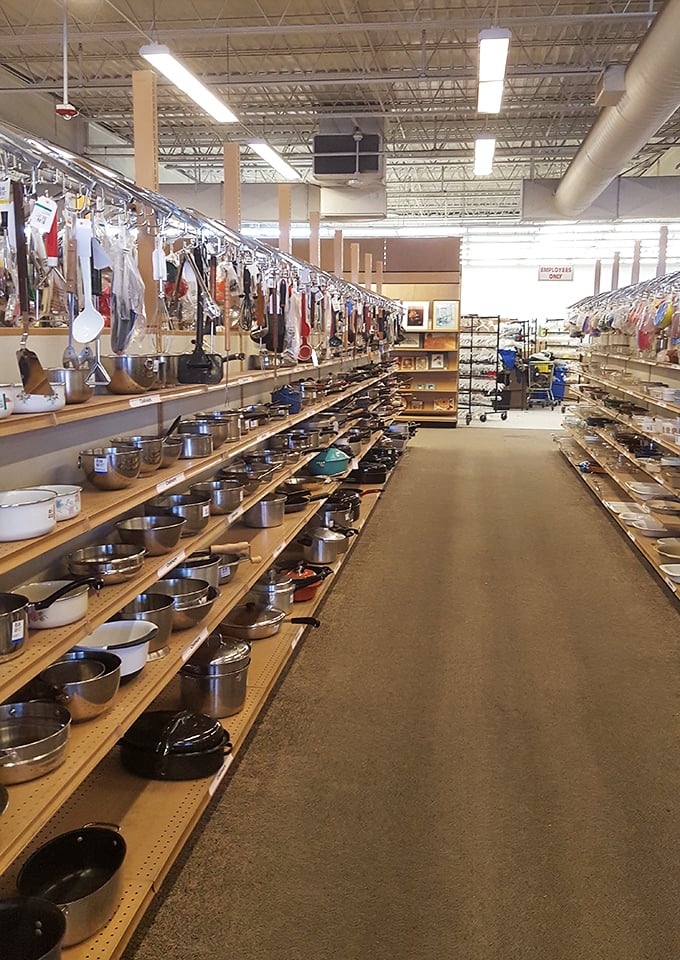 Pots and pans and kitchen dreams line these shelves like a culinary time capsule. That copper-bottom revere ware? Your grandmother would approve.