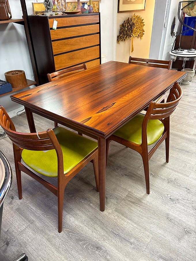 This rosewood dining set with lime green chairs isn't just furniture—it's a time capsule from when dinner parties were an art form.