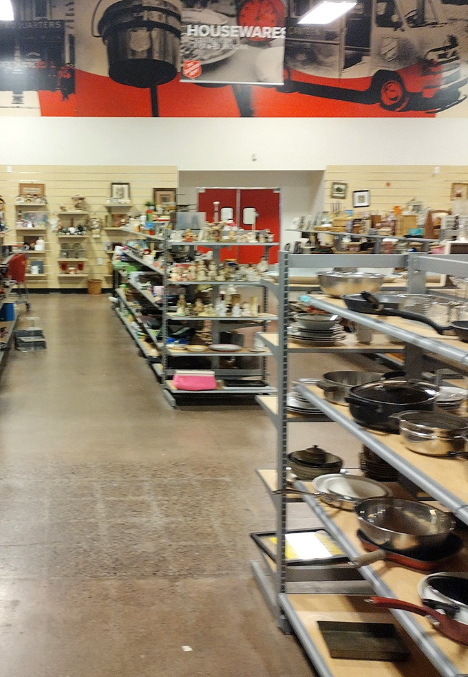 Rows upon rows of cookware await new kitchens—those cast iron skillets have stories to tell and meals yet to make.