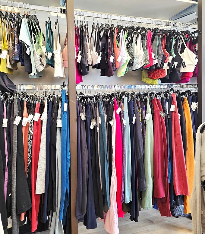 Rainbow racks of possibility! Each hanger holds someone else's fashion regret that might become your next favorite outfit.
