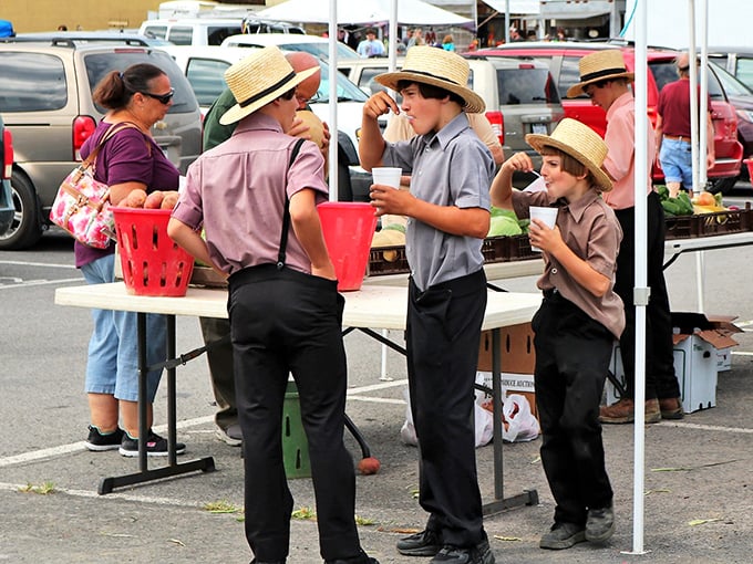 Young Amish men enjoying refreshments at the farmers market. Some traditions evolve while preserving what matters most—community and good food.