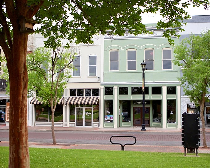 Historic storefronts in soft pastels create a downtown that feels like stepping into a watercolor painting—one where you can actually afford the real estate.