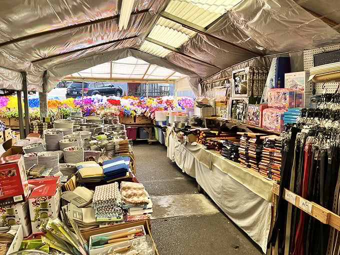 A tent of possibilities—where colorful artificial flowers bloom year-round next to practical kitchenware and linens for every occasion.