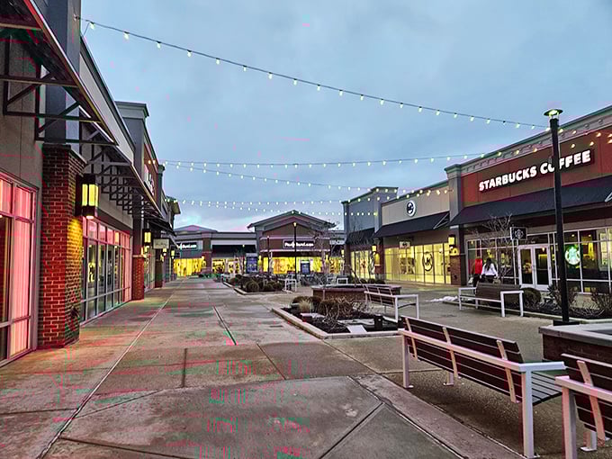 Evening at the outlets transforms the ordinary into magical. Those string lights aren't just illumination—they're like fireflies guiding you to your next great find.