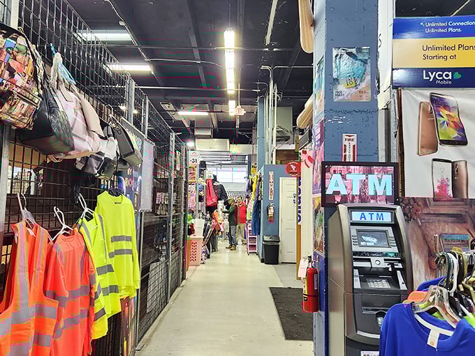 Fluorescent lights illuminate this retail labyrinth where ATMs stand ready to fuel your shopping adventure. Neon signs: the universal language of "deals inside."