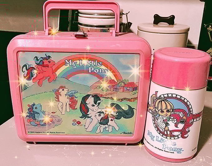 Remember these? Vintage lunch boxes like this My Little Pony set aren't just nostalgic collectibles—they're time machines disguised as metal rectangles.