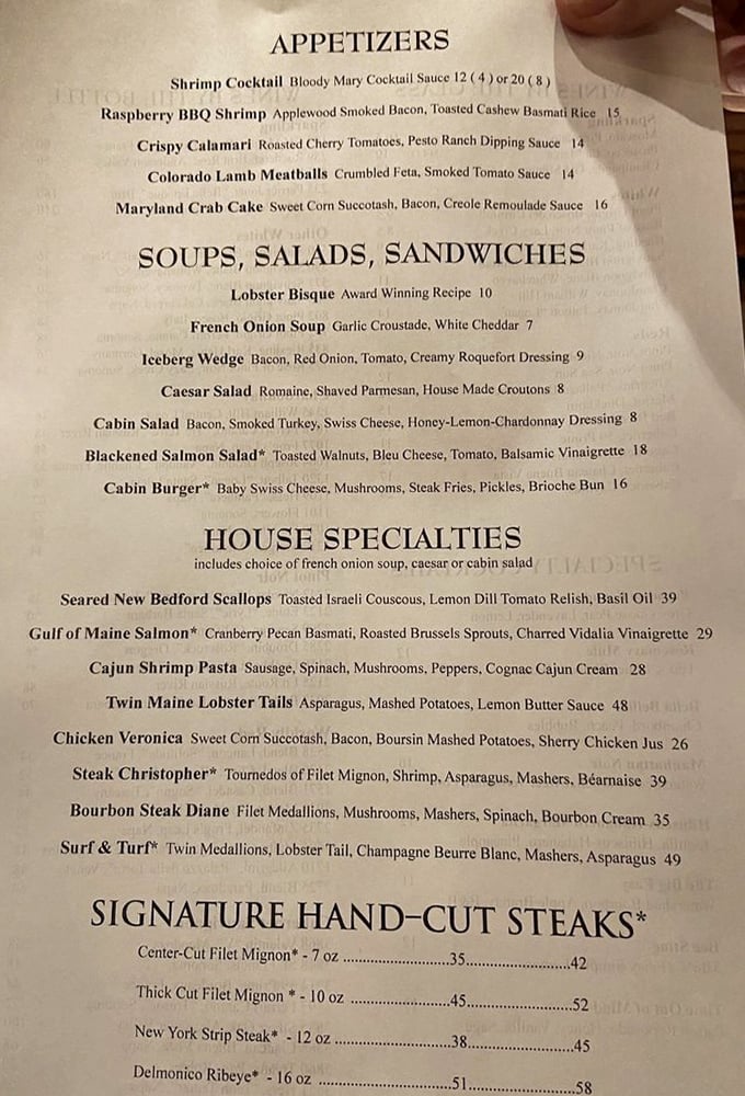 The menu reads like a love letter to carnivores and seafood enthusiasts alike, with each description promising a vacation for your taste buds.