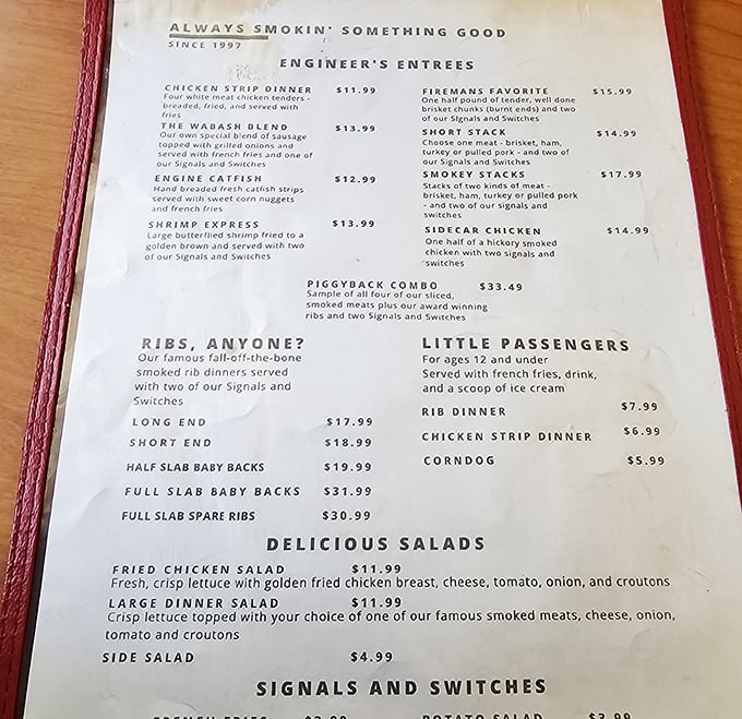 The menu reads like a love letter to smoked meat enthusiasts—"Engineer's Entrees" and "Little Passengers" continuing the charming railroad theme.
