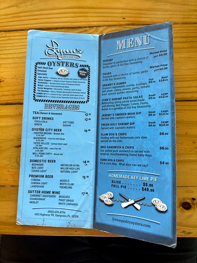 The blue menu tells no lies—this is the roadmap to seafood nirvana, with that key lime pie temptation lurking at the bottom.