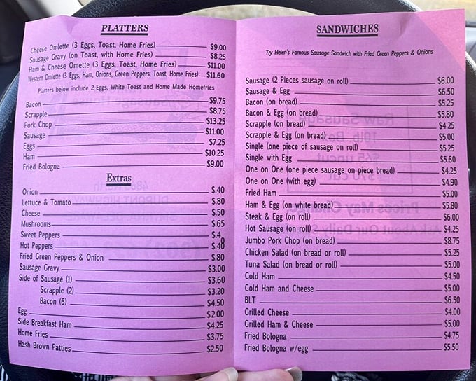 The pink menu tells a story of breakfast classics done right. No avocado toast here, just timeless comfort that's kept folks coming back for decades.