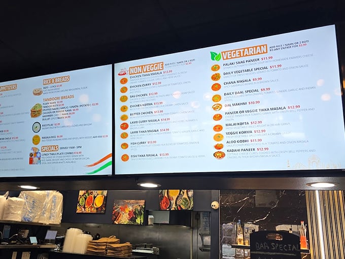 The menu board reads like a treasure map of Indian cuisine, with each dish promising its own delicious adventure.