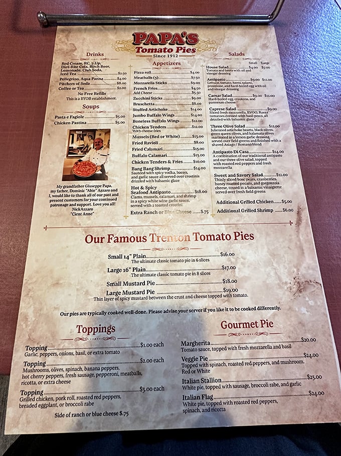 The menu tells stories between its lines. Notice that mustard pie description—a thin layer of spicy mustard that transforms pizza into something uniquely, wonderfully Jersey.