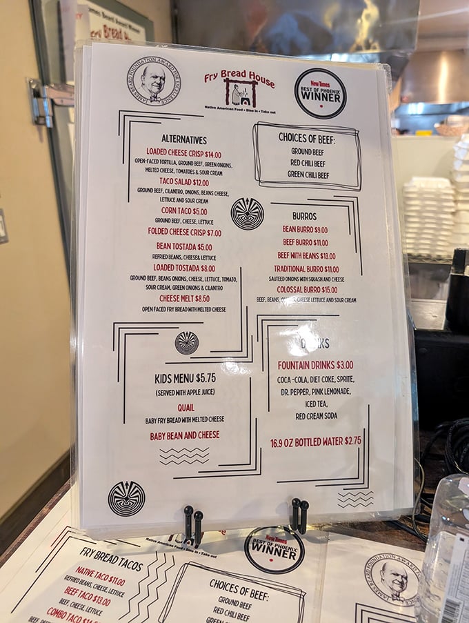 The menu tells a story of cultural preservation through food—notice the traditional symbols and the James Beard Award winner seal.