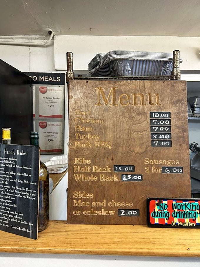 This hand-carved wooden menu board tells you everything you need to know about Jake's priorities: meat first, simplicity always, and absolutely no pretension.