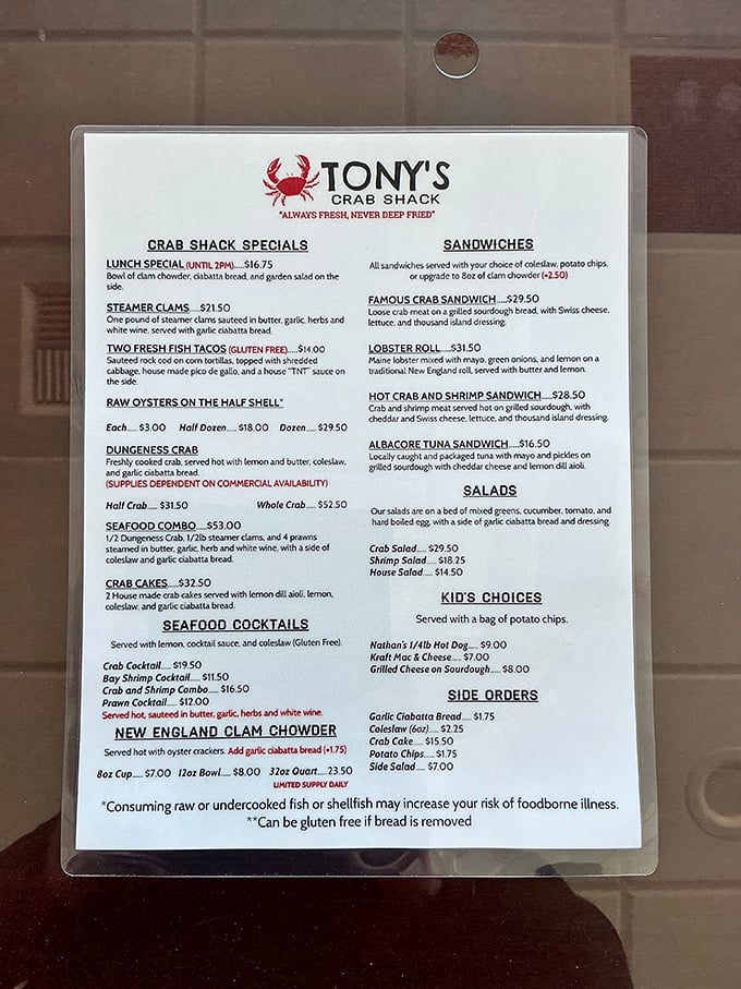 A menu that reads like coastal poetry—whole crab, seafood cocktails, and that famous crab sandwich that haunts dreams long after you've left Bandon.