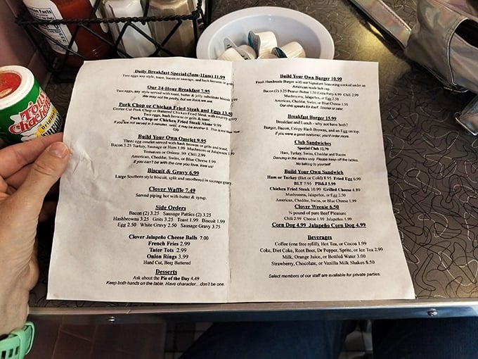 The menu reads like a love letter to American comfort food, promising everything from hubcap-cooked burgers to fluffy omelets that could cure any ailment.