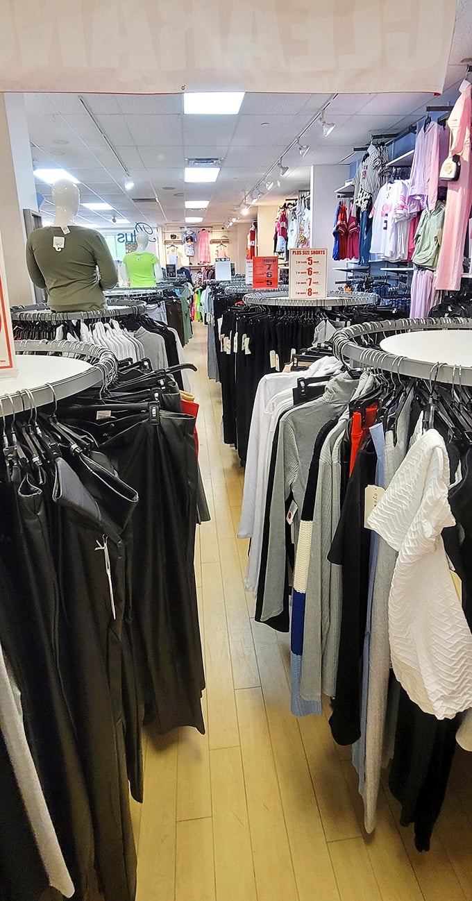 Fashion's front lines where the battle for bargains is waged daily. Those circular racks aren't just displaying clothes—they're showcasing potential victories over retail pricing.
