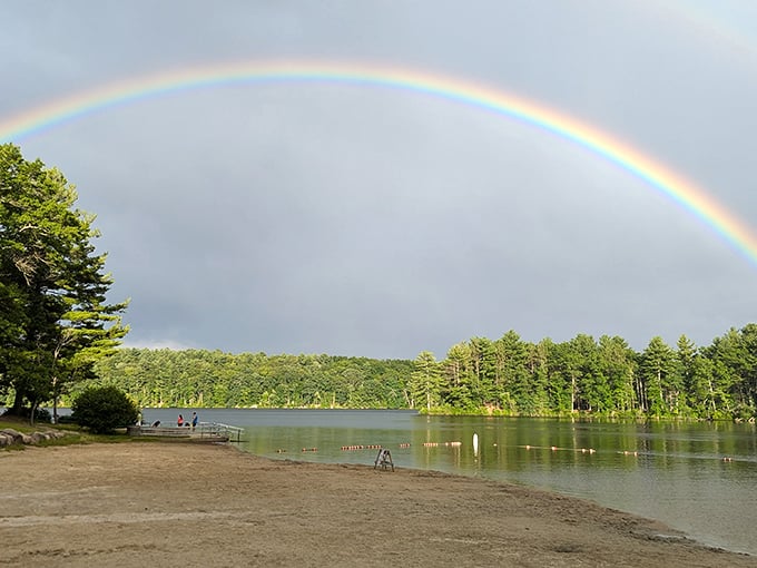 Mother Nature showing off with a full rainbow over Ashland's waters—like she's saying, "You're welcome for this Instagram moment that requires zero filters."