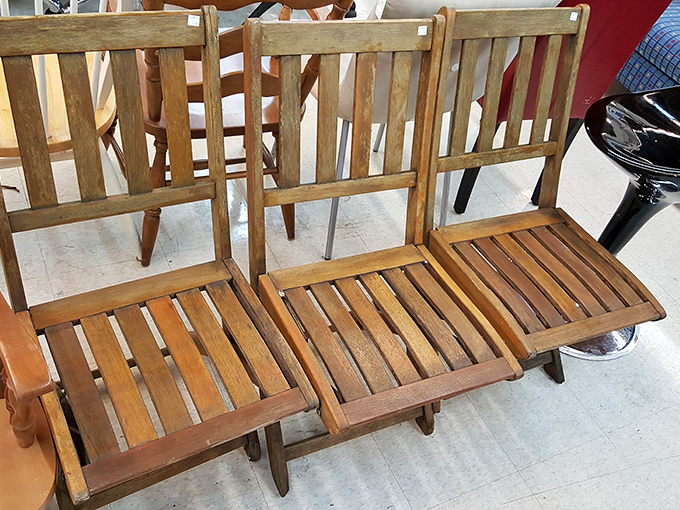 Mid-century magic in triplicate. These wooden folding chairs aren't just seating—they're time machines to Grandma's porch, waiting for their second act.