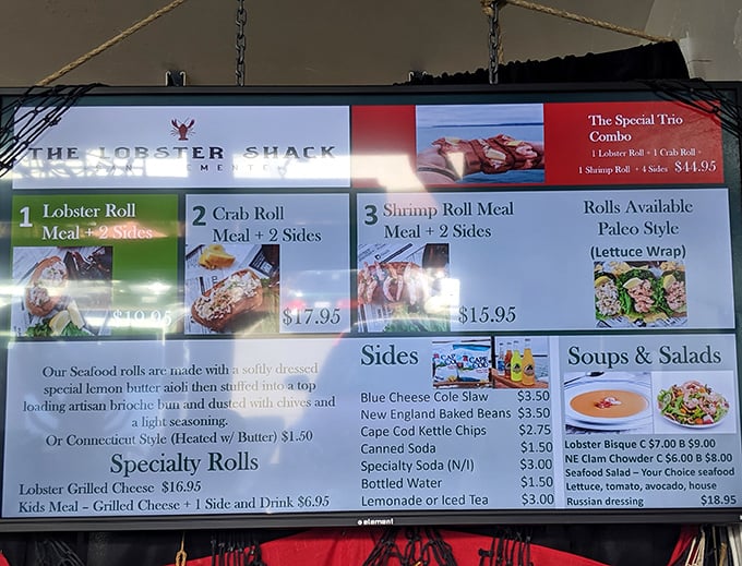 The menu board reveals the holy trinity of seafood rolls – lobster, crab, and shrimp – each promising a brief but meaningful relationship with your taste buds.