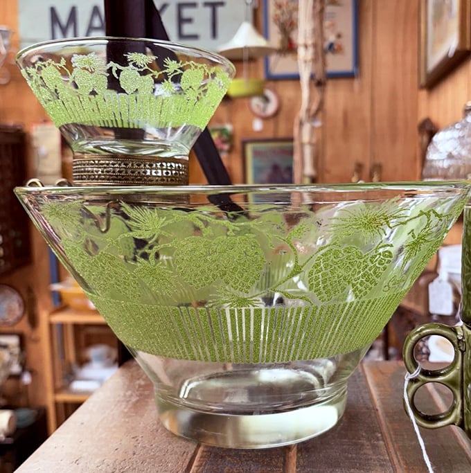 This mid-century green glass bowl isn't just serveware—it's a conversation piece that whispers tales of martini parties and deviled egg platters.