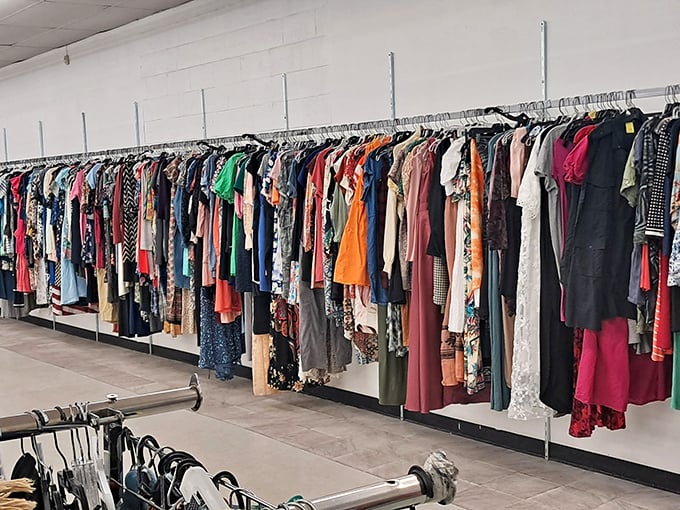 A rainbow of possibilities hangs in wait. Each garment carries its own history, ready for you to write the next chapter.