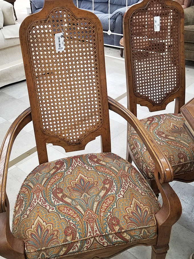 These cane-backed chairs with paisley upholstery aren't just furniture—they're time machines to Grandma's formal dining room, minus the plastic slipcovers.