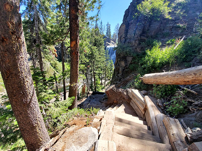 These rustic wooden steps aren't just a trail – they're a stairway to paradise. Each step brings you closer to that thunderous symphony ahead.