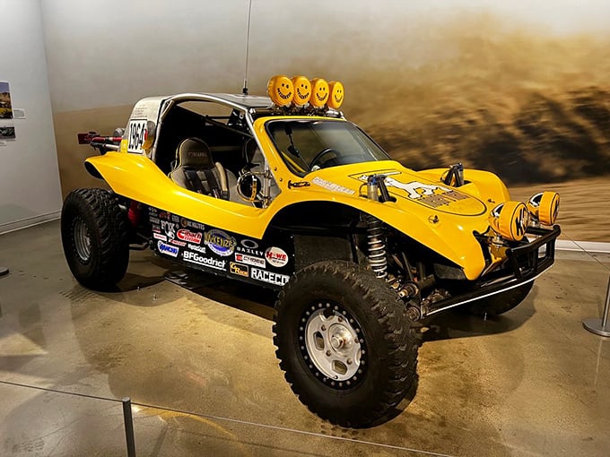 The cheerful yellow dune buggy grins with its headlight "eyes," ready for sandy adventures. Those smiley-face lights aren't just decoration—they're a mood you can drive.