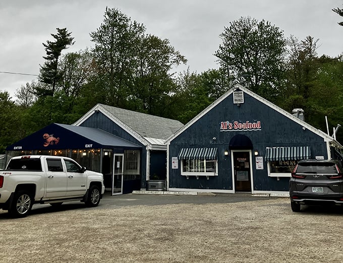 Classic seafood shack vibes — where the blue exterior and the backdrop of towering trees create a cozy spot that perfectly matches the soul of the food.