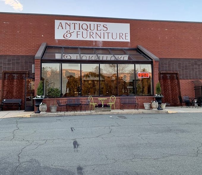Antiques & Furniture spelled out in elegant letters – a humble introduction to Greensboro's not-so-humble collection of timeless treasures.