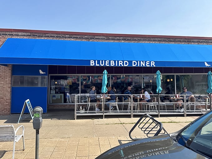 Bright blue awnings and brick walls create the perfect backdrop for serious comfort food and friendly conversation.