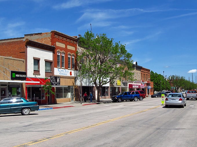 Tree-lined streets create natural shade for budget-conscious retirees seeking small-town tranquility and charm.