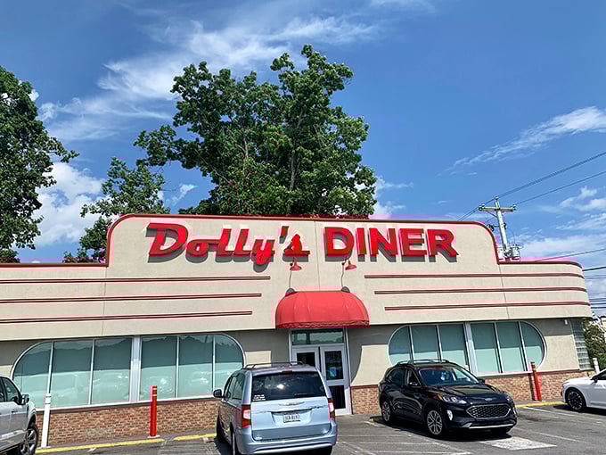 Dolly's Diner's retro facade is like a time machine with a side of fries. Those red letters have been calling hungry travelers for generations.