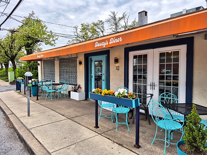 Doozy's Diner's charming orange awning and turquoise chairs invite you to sit awhile and watch the world go by.