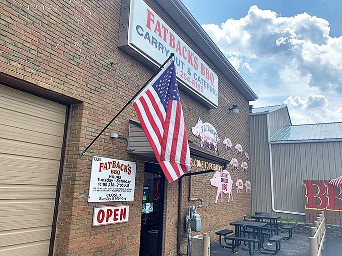 That patriotic flag waves proudly over Fatback's - where American BBQ traditions get the respect they deserve.