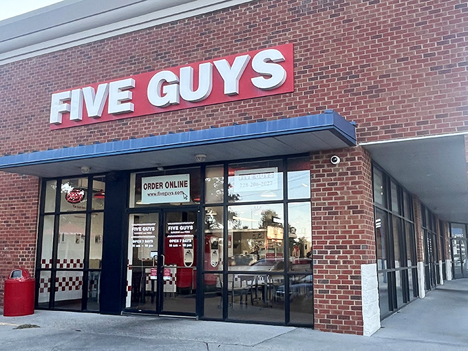 Five Guys' familiar brick facade houses not just great burgers, but hot dogs worthy of Mississippi's coastal appreciation.