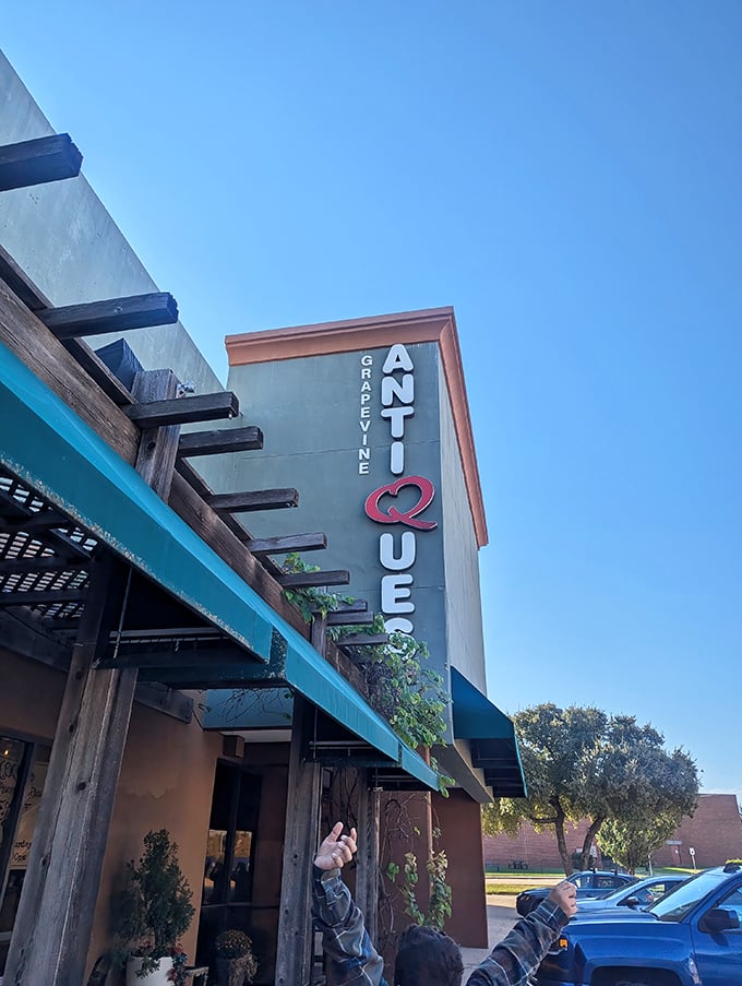 Grapevine Antique Queens stands tall against the Texas sky, beckoning collectors with its distinctive vertical signage.