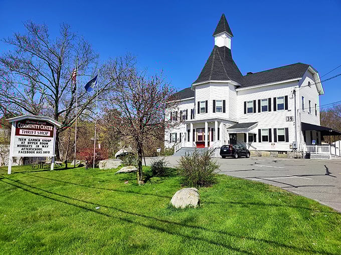 This charming white building with its steeple looks like it stepped out of a Norman Rockwell painting.