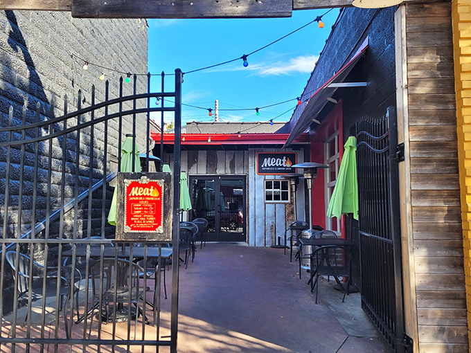 Meat BBQ's unassuming entrance hides behind brick walls – like finding a secret doorway to smoked meat paradise in Lansing.