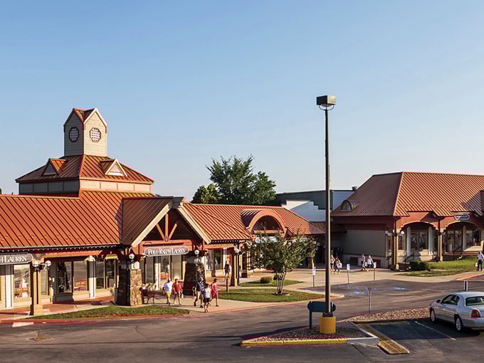 Osage Beach Outlet Marketplace stands ready for bargain hunters like a retail oasis. Even your sunglasses can't hide your excitement!