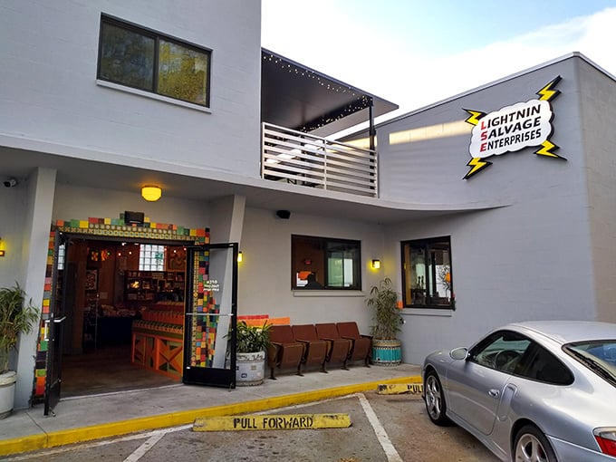 Satchel's yellow house exterior promises quirky charm before you even taste the pizza.