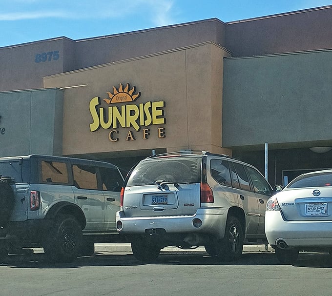 The Original Sunrise Cafe's cheerful sign is like Vegas itself – bright, welcoming, and promising a good time.
